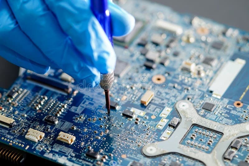 Technician Repairing Inside of Hard Disk by Soldering Iron. Integrated ...