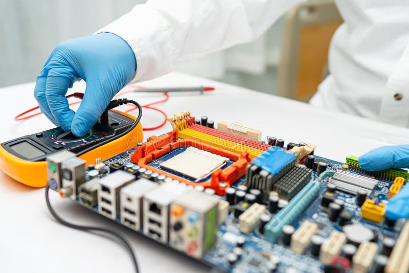 Technician Repairing Inside of Hard Disk by Soldering Iron. Integrated ...