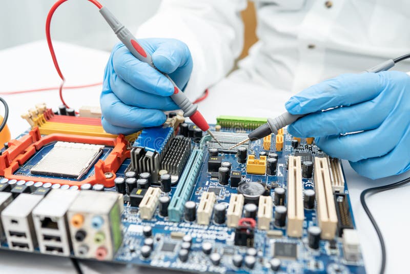 Technician Repairing Inside of Hard Disk by Soldering Iron. Integrated ...