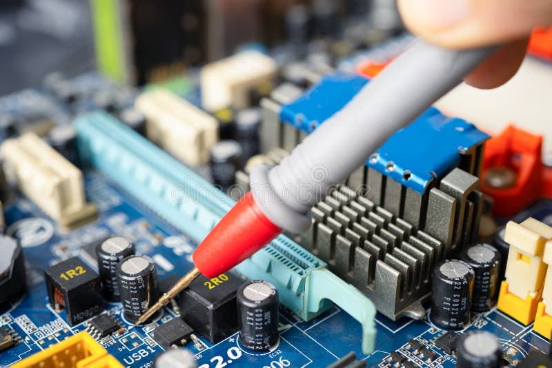 Technician Repairing Inside of Hard Disk by Soldering Iron. Integrated ...