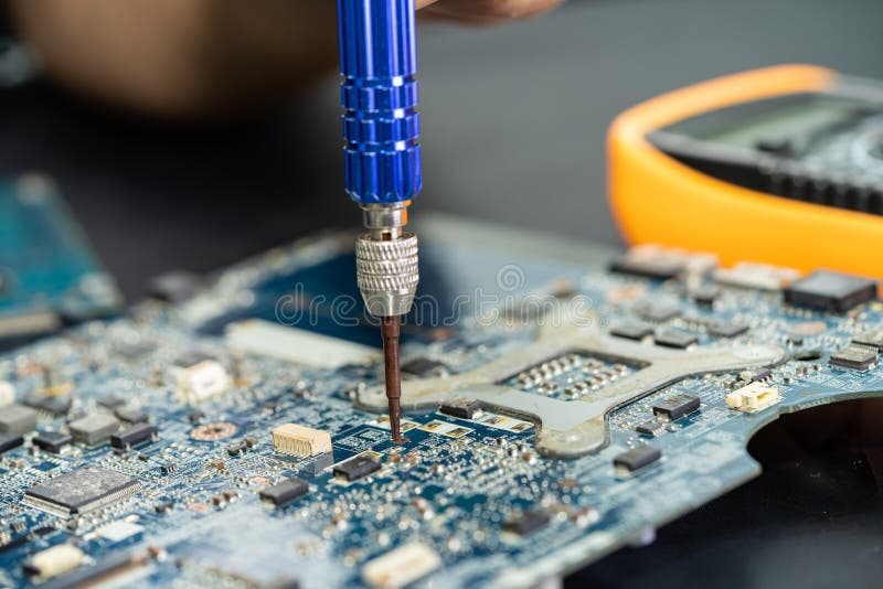 Technician Repairing Inside of Mobile Phone. Integrated Circuit. the ... Technician Repairing Inside of Mobile Phone. Integrated Circuit. the ...
