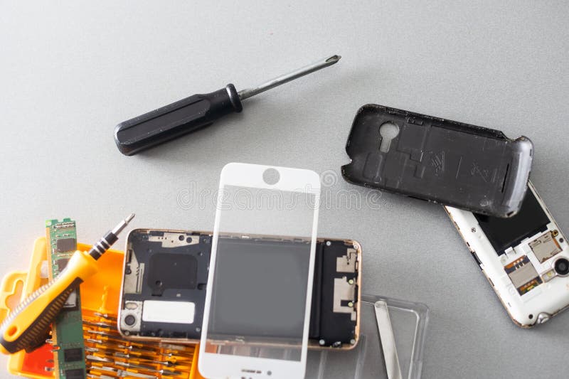 Technician Repairing Inside of Mobile Phone by Soldering Iron. the ...