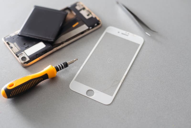 Technician Repairing Inside of Mobile Phone by Soldering Iron. the ... Technician Repairing Inside of Mobile Phone by Soldering Iron. the ...