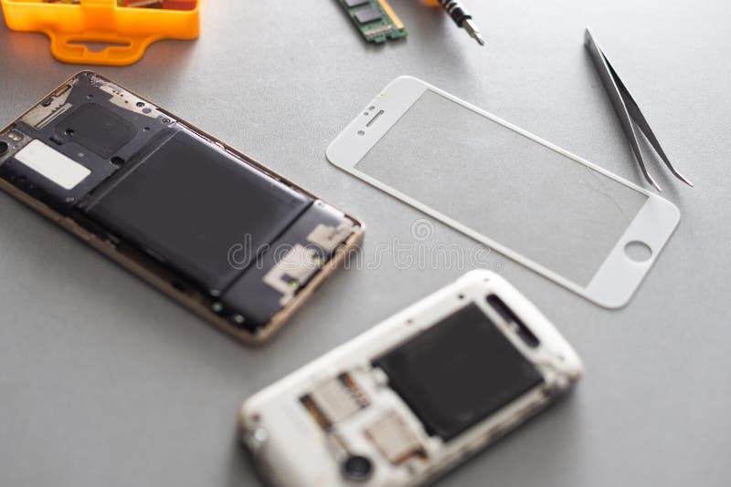 Technician Repairing Inside of Mobile Phone by Soldering Iron. the ...