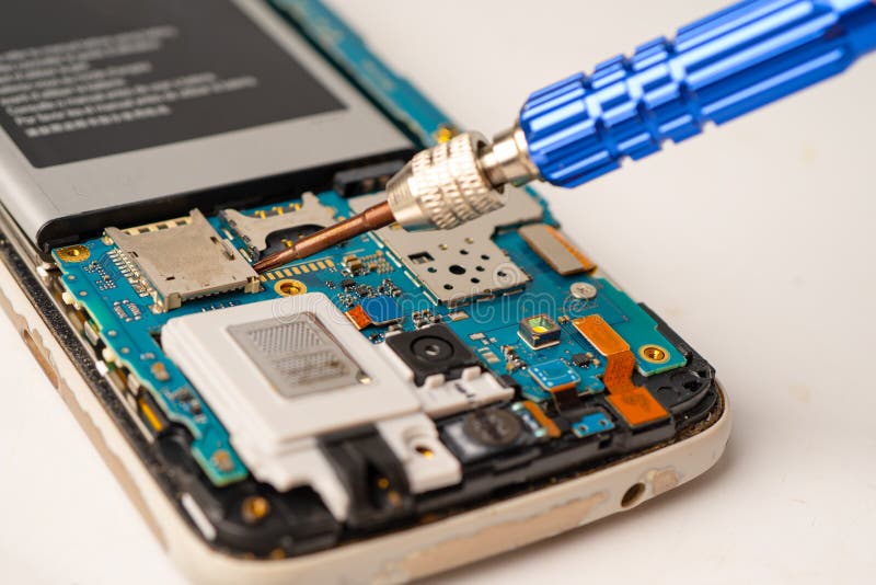 Technician Repairing Inside of Mobile Phone by Soldering Iron ...