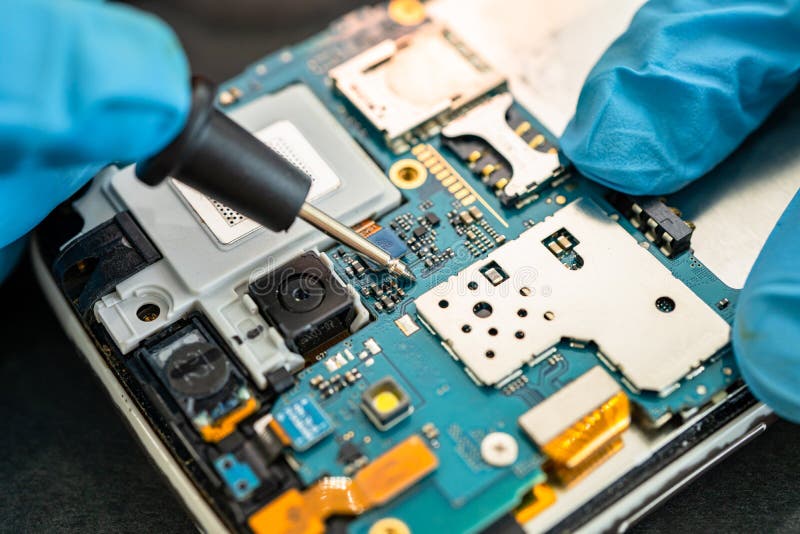 Technician Repairing Inside of Mobile Phone by Soldering Iron ...