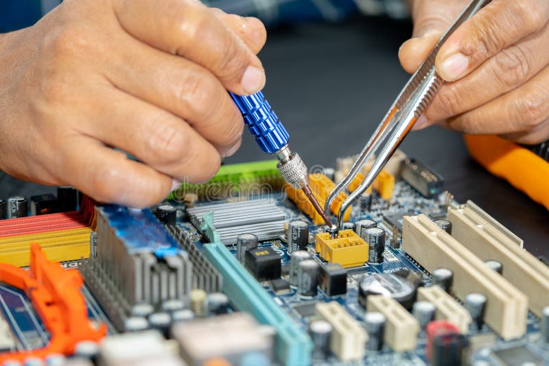 Technician Repairing Inside of Mobile Phone by Soldering Iron ...