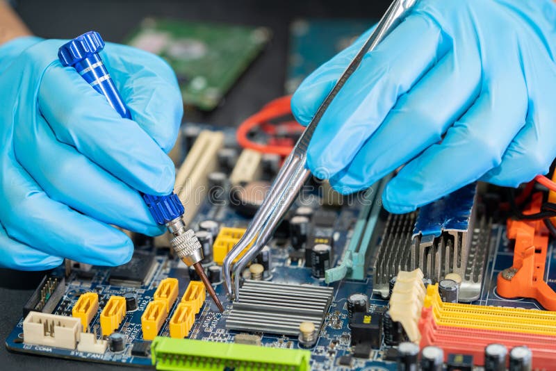 Technician Repairing Inside of Mobile Phone by Soldering Iron ...