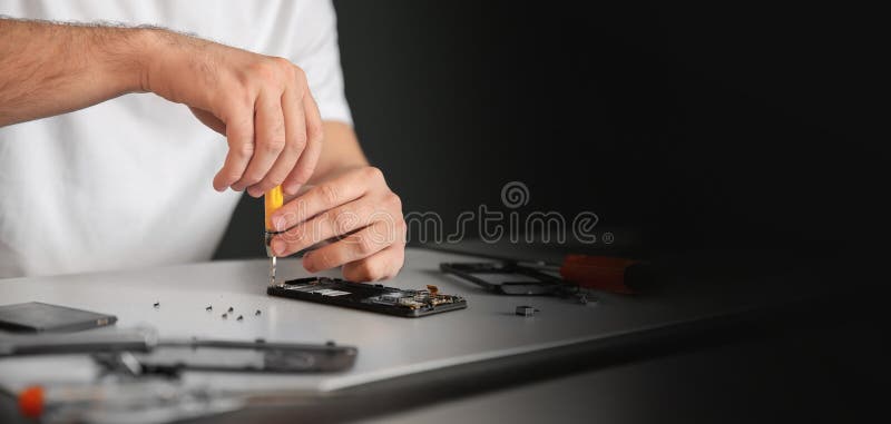 Technician Repairing Mobile Phone at Table. Banner Design Stock Photo ...