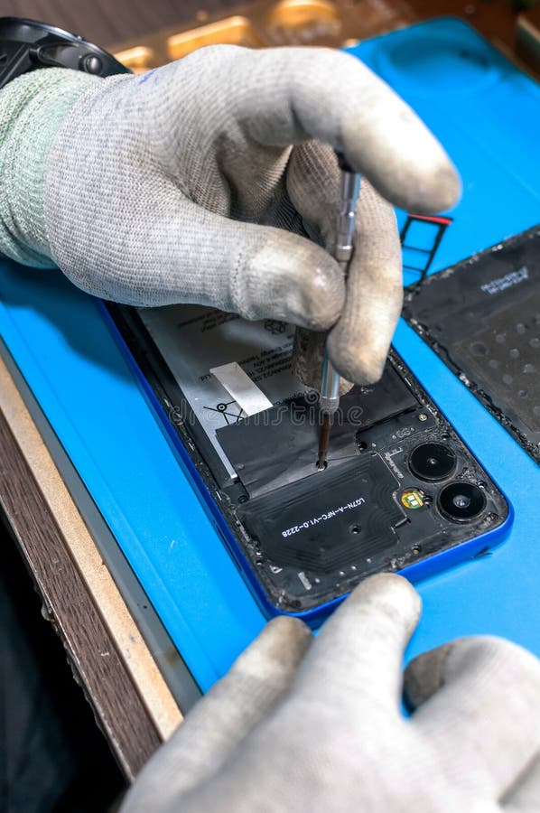 Technician Repairing a Smart Phone at His Workshop Stock Image - Image ...