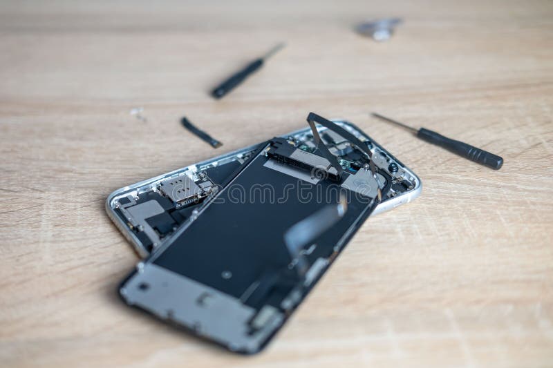 Smartphone Repair Process with Screwdriver and Disassembled Mobile ...