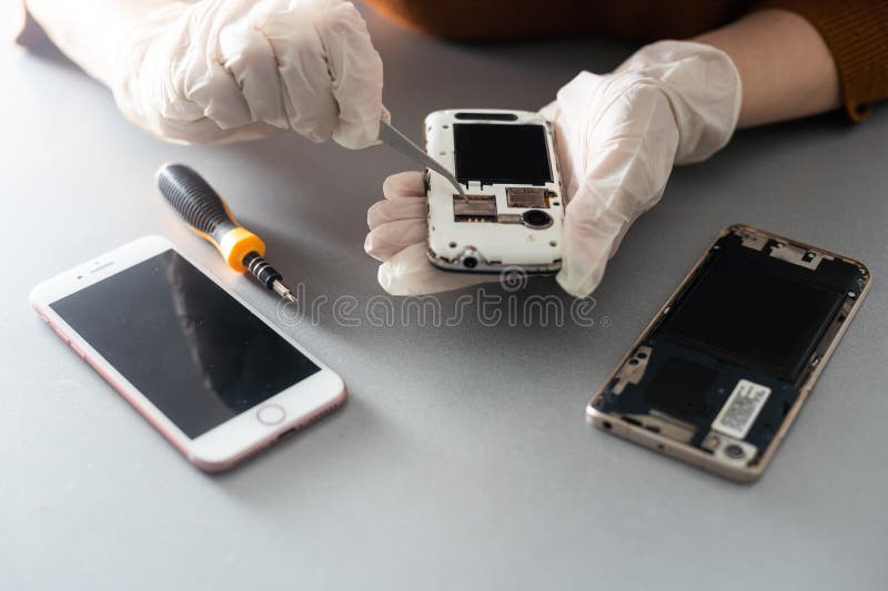 The Technician Repairing the Smartphone S Motherboard in the Lab with ...