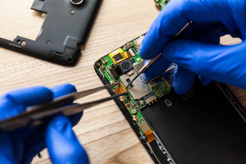 The Technician Repairing the Smartphone& X27;s Motherboard in the ...