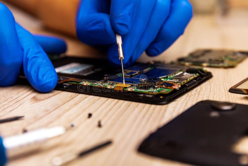 The Technician Repairing the Smartphone& X27;s Motherboard in the ...