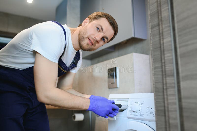 Technician Repairing a Washing Machine Stock Photo - Image of adult ...
