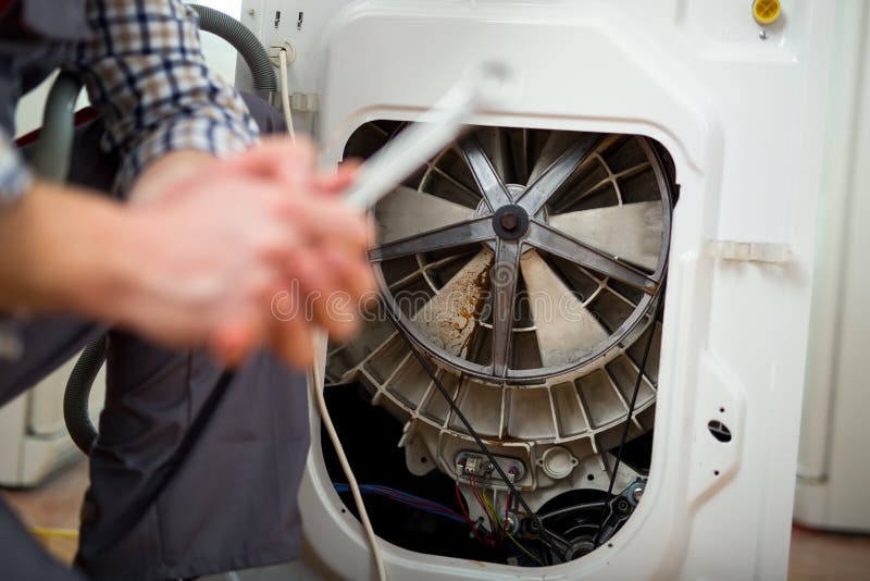 Technician Repairing a Washing Machine Stock Photo - Image of house ...