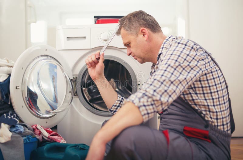Technician Repairing a Washing Machine Stock Photo - Image of fixing ...