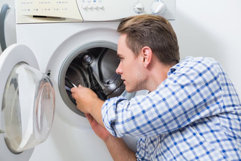Washing machine repair stock photo. Image of profession - 26830976