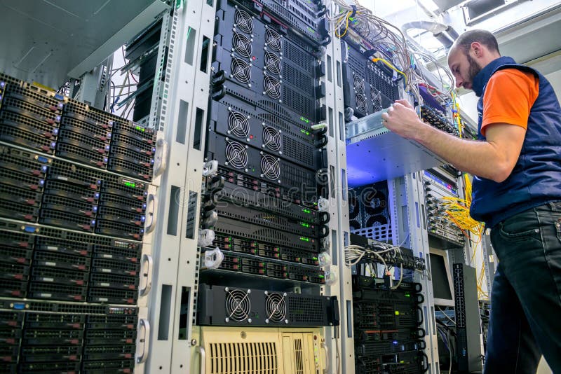 Technician Repairs the Central Router. Man Works in a Server Room Stock ...
