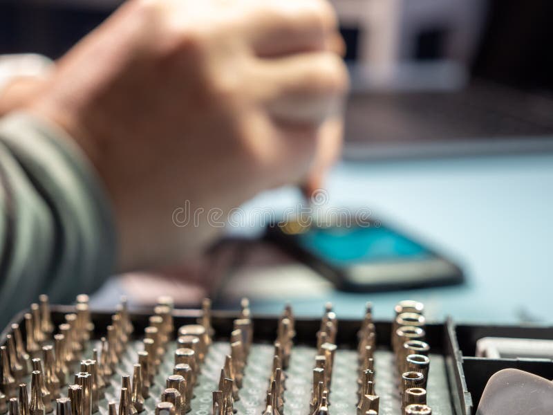A Technician Repairs a Smartphone in a Laboratory with Copy Space ...