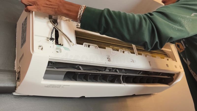 A Technician Repairs a Wall Mounted Air Conditioner and Fixing HVAC ...