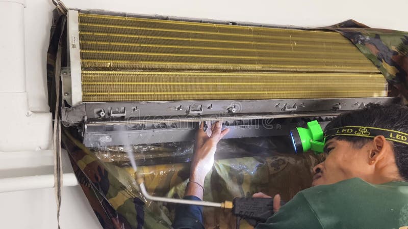 A Technician Rinsing a Wall Mounted Air Conditioner and Fixing HVAC ...
