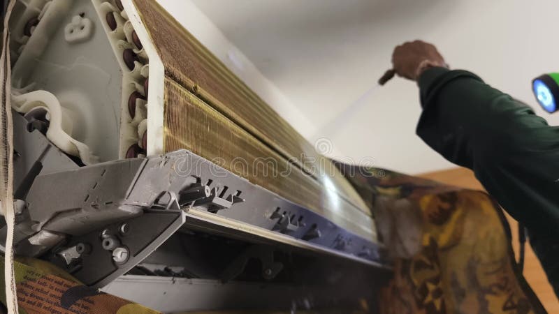A Technician Rinsing a Wall Mounted Air Conditioner and Fixing HVAC ...