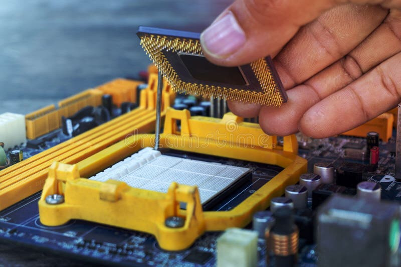 Technician S Hand Holding the Chip Microprocessor and Fixing the ...