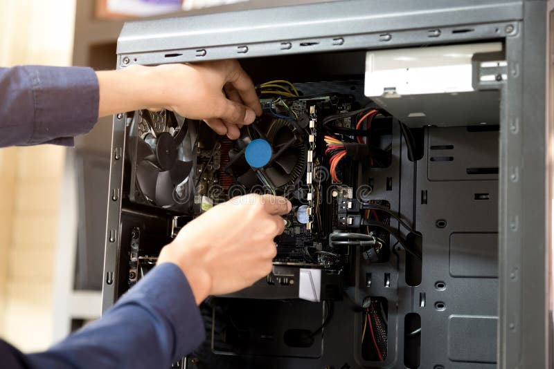Technician with a Screwdriver for Fixing Computers, Computer Har Stock ...
