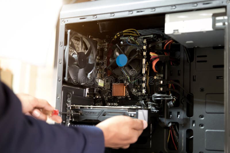 Technician with a Screwdriver for Fixing Computers, Computer Har Stock ...