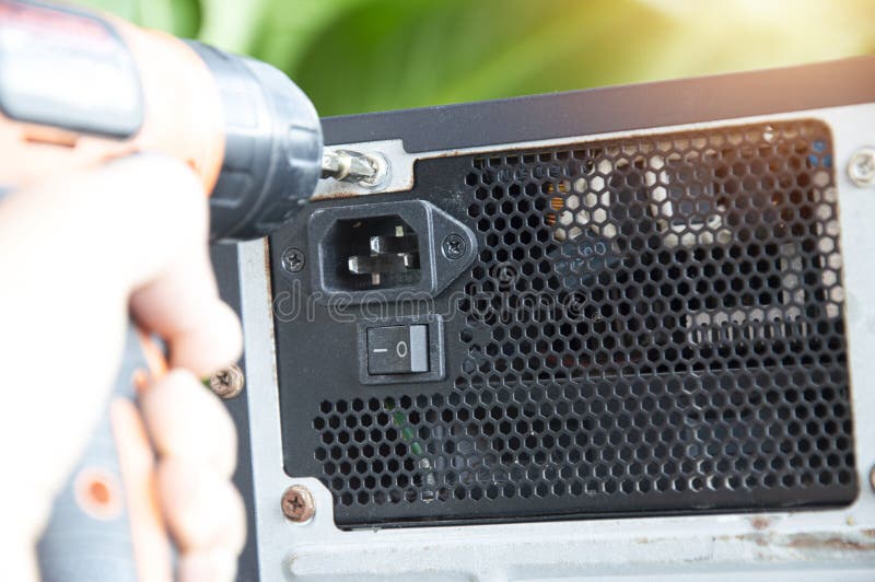 Technician Screwing the Back of the Computer, Fixing the Computer Stock ...