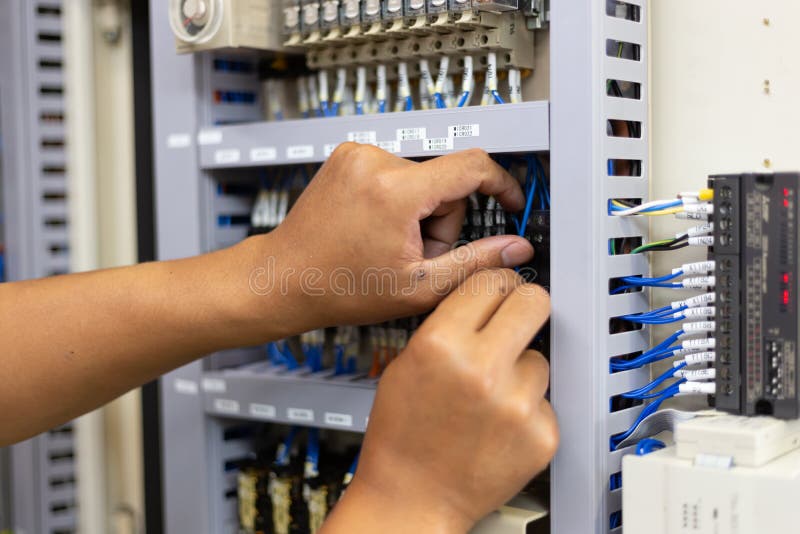 Technician Setting Electric Control Box of Machine in Factory Stock ...
