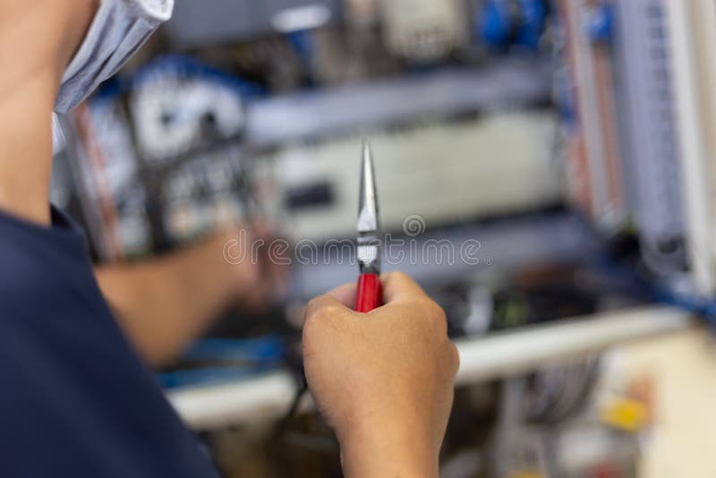 Technician Setting Electric Control Box of Machine in Factory Stock ...