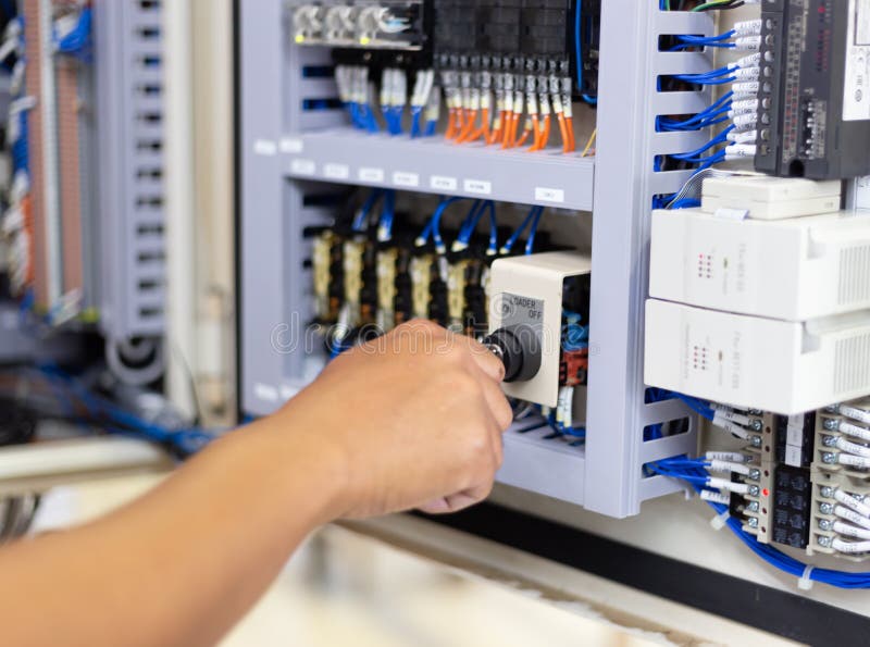 Technician Setting Electric Control Box of Machine in Factory Stock ...