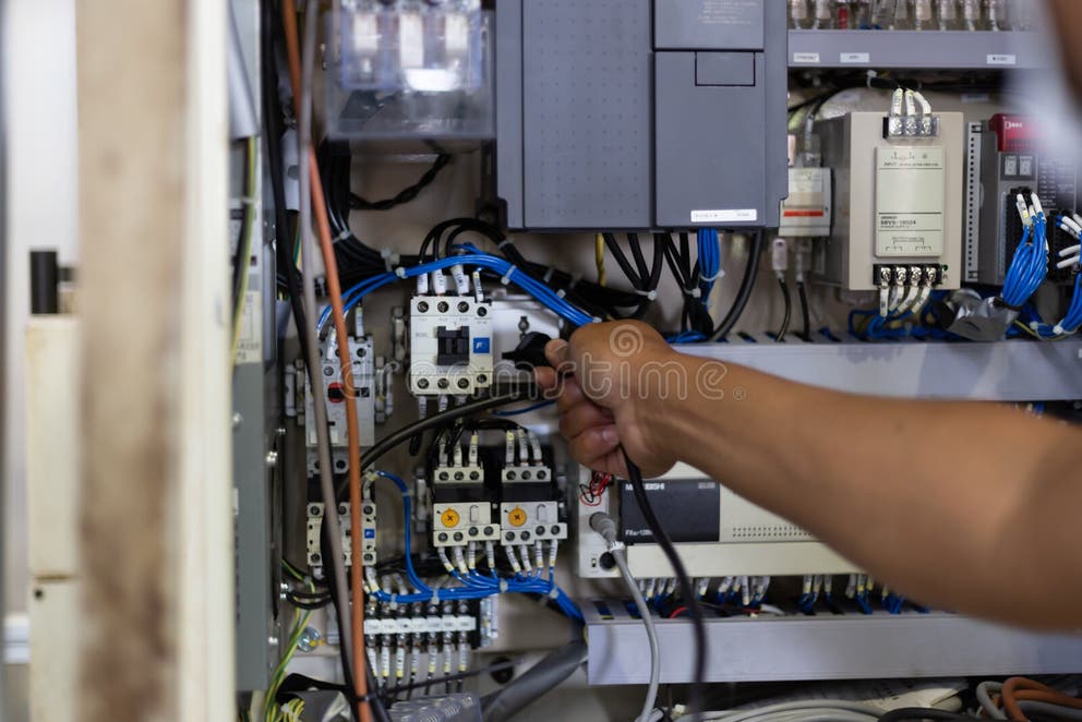 Technician Setting Electric Control Box of Machine in Factory Stock ...