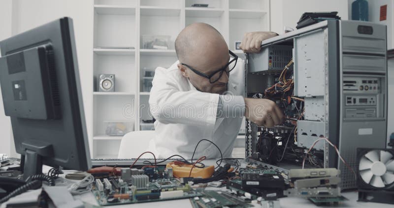 Technician Damaging a Computer with a Screwdriver Stock Photo - Image ...