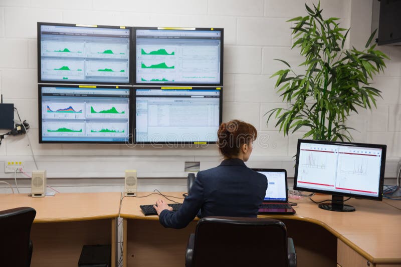 Technician Sitting in Office Running Diagnostics Stock Photo - Image of ...