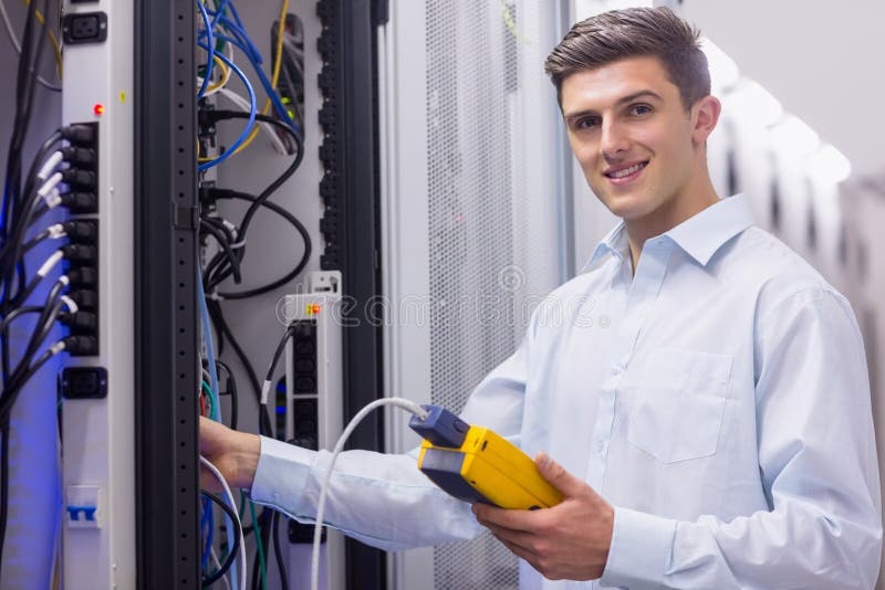 Technician Smiling at Camera while Fixing Server Stock Image - Image of ...