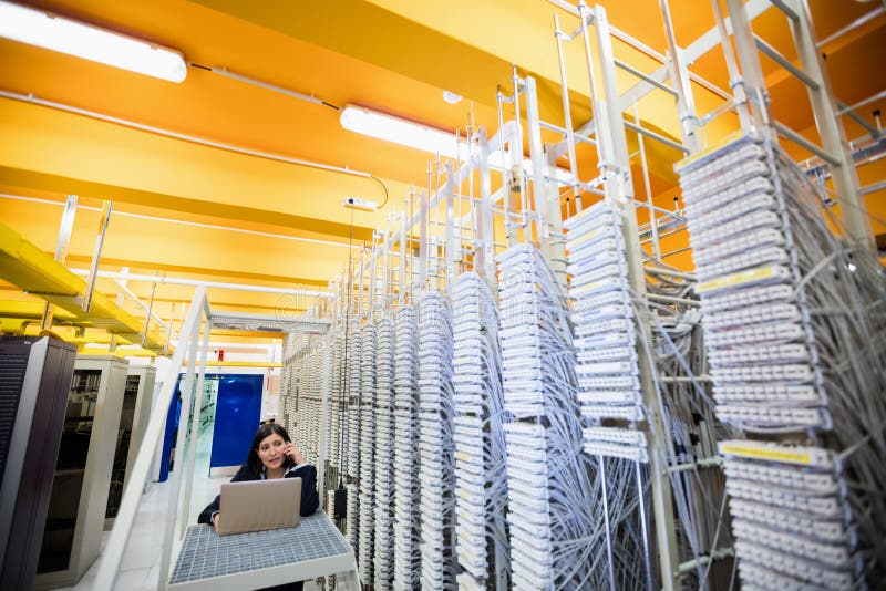 Technician Talking on Mobile Phone in Server Room Stock Image - Image ...