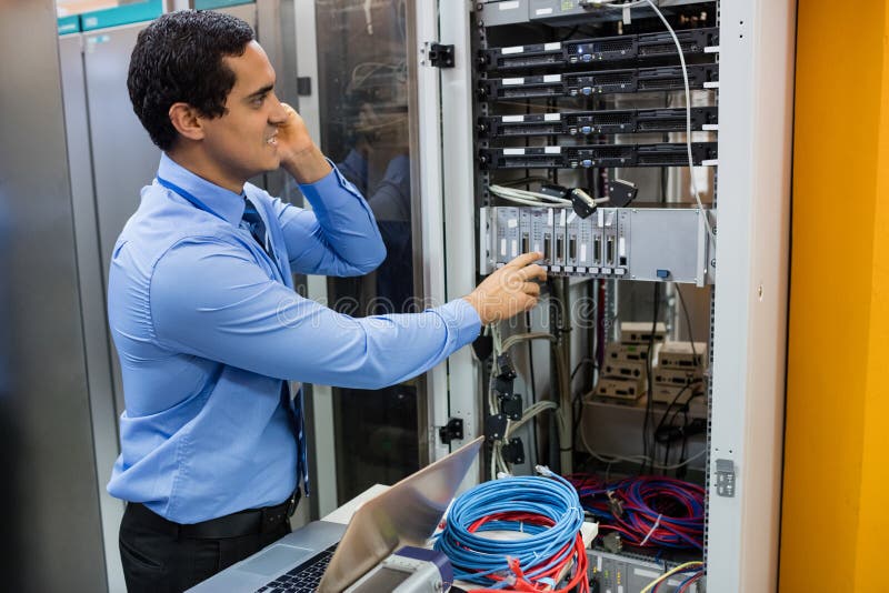 Technician Talking on Mobile Phone Stock Photo - Image of computer ...