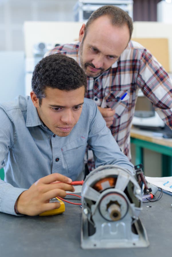 Technician Testing Alternator with Multimeter Stock Image - Image of ...