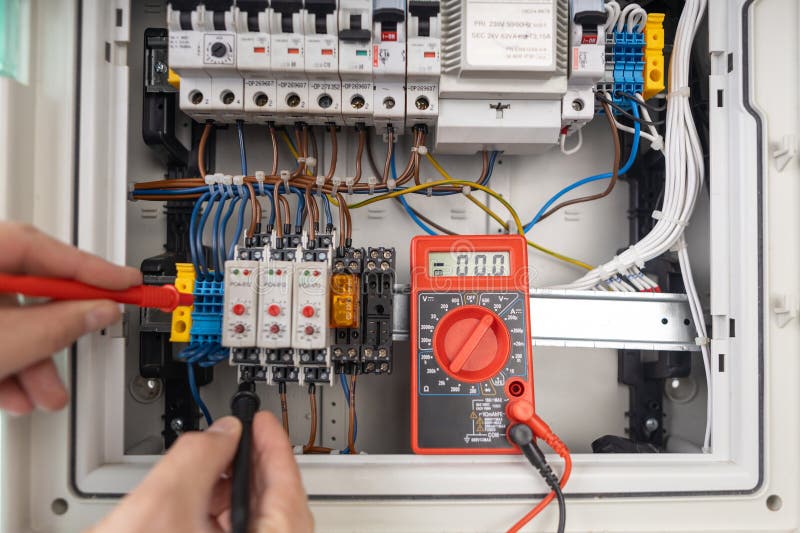Technician Testing Electrical Circuit Board with Multimeter Stock ...