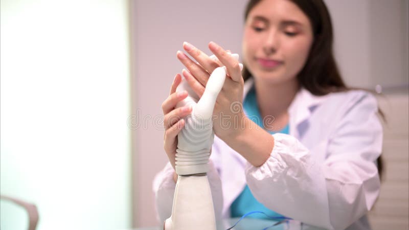 Technician Testing Robotic Bionic Arm at Prosthetic Manufacturing Stock ...