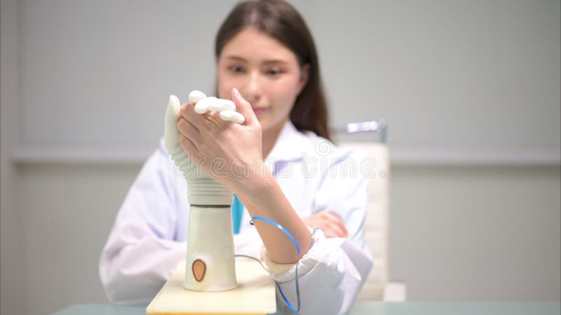 Technician Testing Robotic Bionic Arm at Prosthetic Manufacturing Stock ...