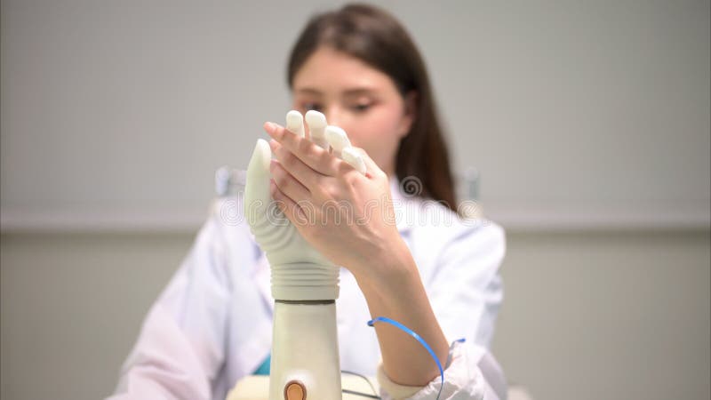Technician Testing Robotic Bionic Arm at Prosthetic Manufacturing Stock ...