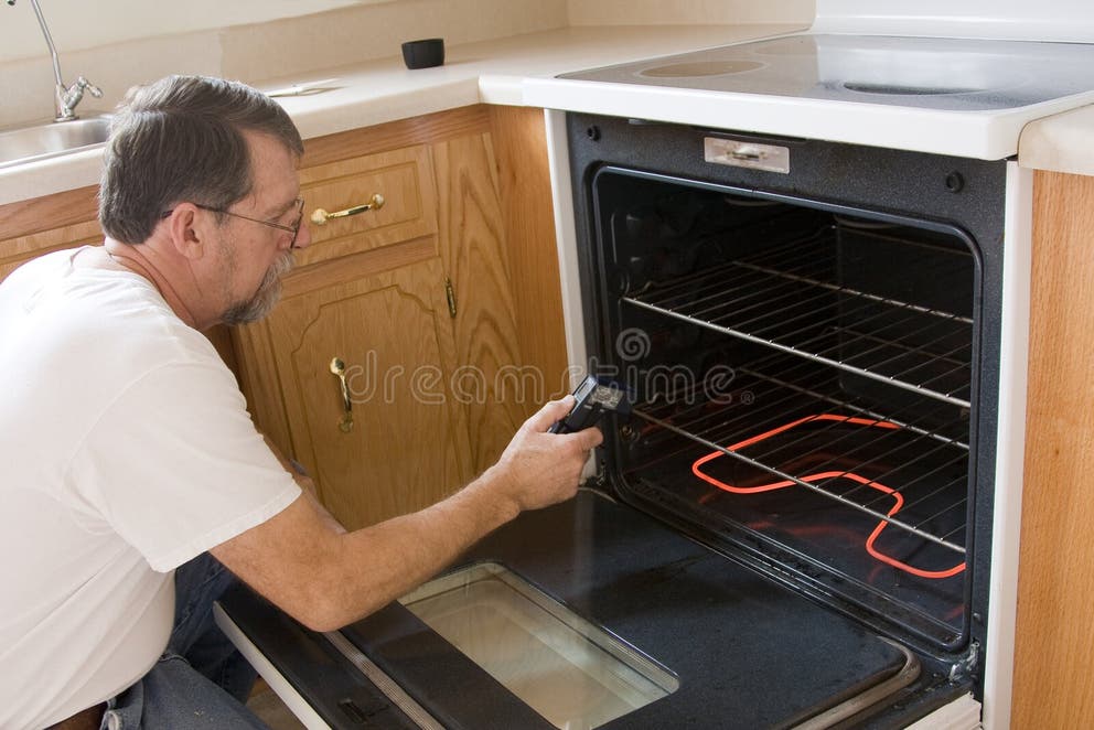 Technician Testing Stove & Oven Stock Photo - Image of infared, burn ...