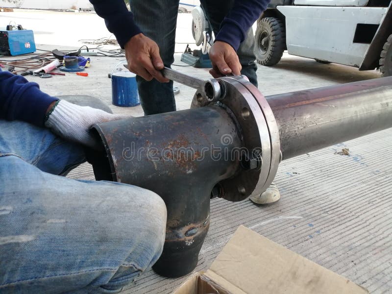 A Technician is Tightening a Pipe Flange Stock Photo - Image of wheel ...