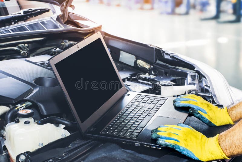 Technician Tuning Engine Car with the Computer Laptop Stock Photo ...