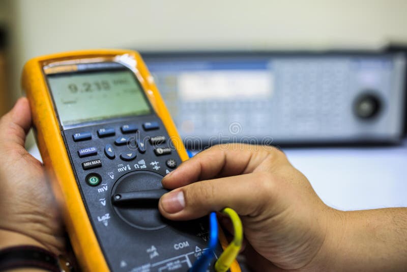 Technician Turn Switch of Multimeter for Calibration with Precision ...