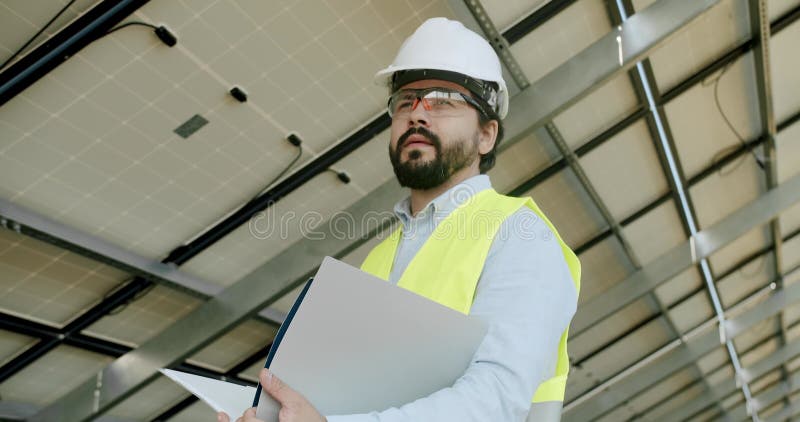 The Technician in Uniform Makes Notes in the Notebook. Stock Video ...